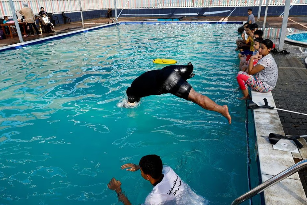 Gaza Amputee is Inspiration to Young Swimmers | About Her